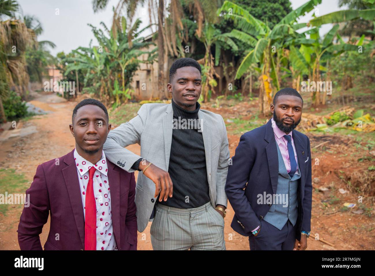 Three elegantly dressed American businessmen with confident gaze ...