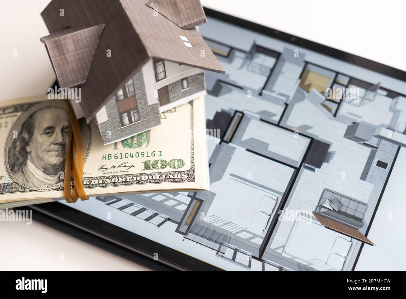 Small house model is on table and icons home electronics devices ...