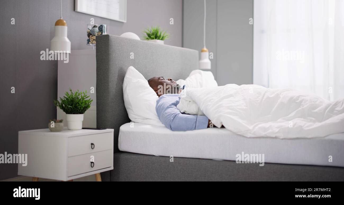 Man Sleeping In Bed. Person Dreaming Asleep Stock Photo - Alamy