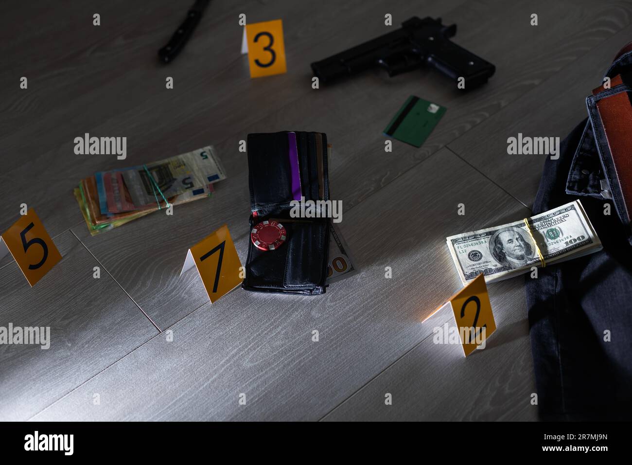 Crime scene investigation concept - Pistol and bullet shell against the ...