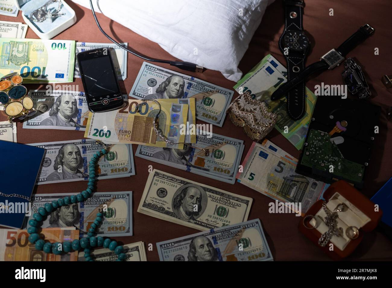 Evidence bag next to dollar banknotes in a crime investigation unit ...