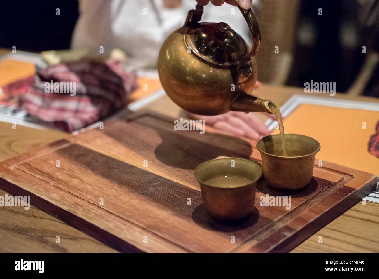 Woman pouring water coffee pot hi-res stock photography and images - Alamy