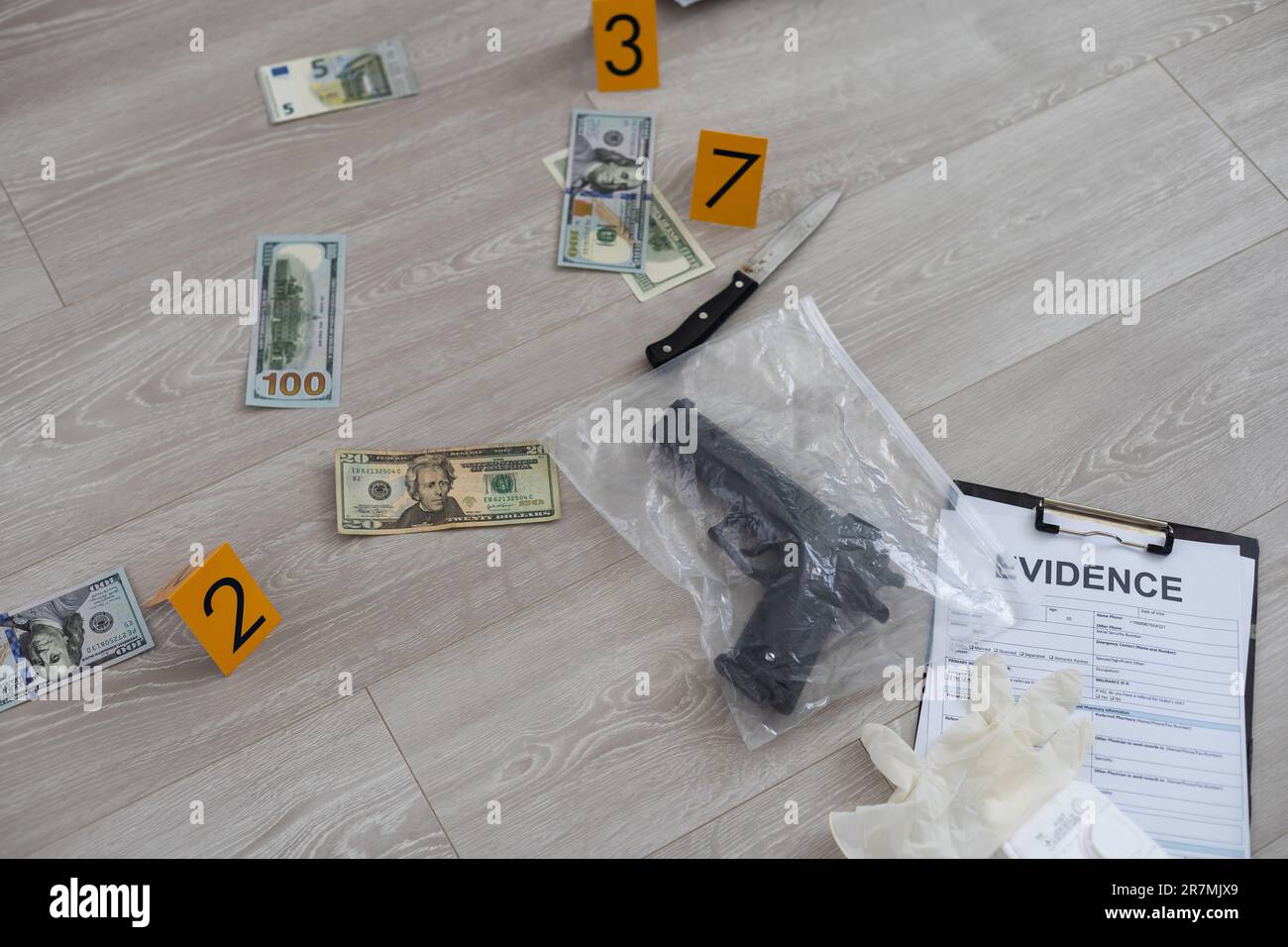 Crime scene concept with a gun and evidence markers high contrast image ...