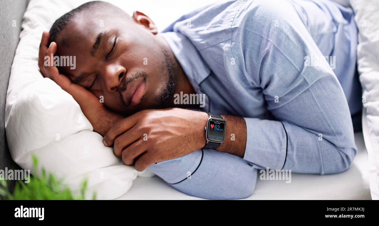 Man Sleeping With Smart Watch In His Hand Showing Heartbeat Rate Stock ...