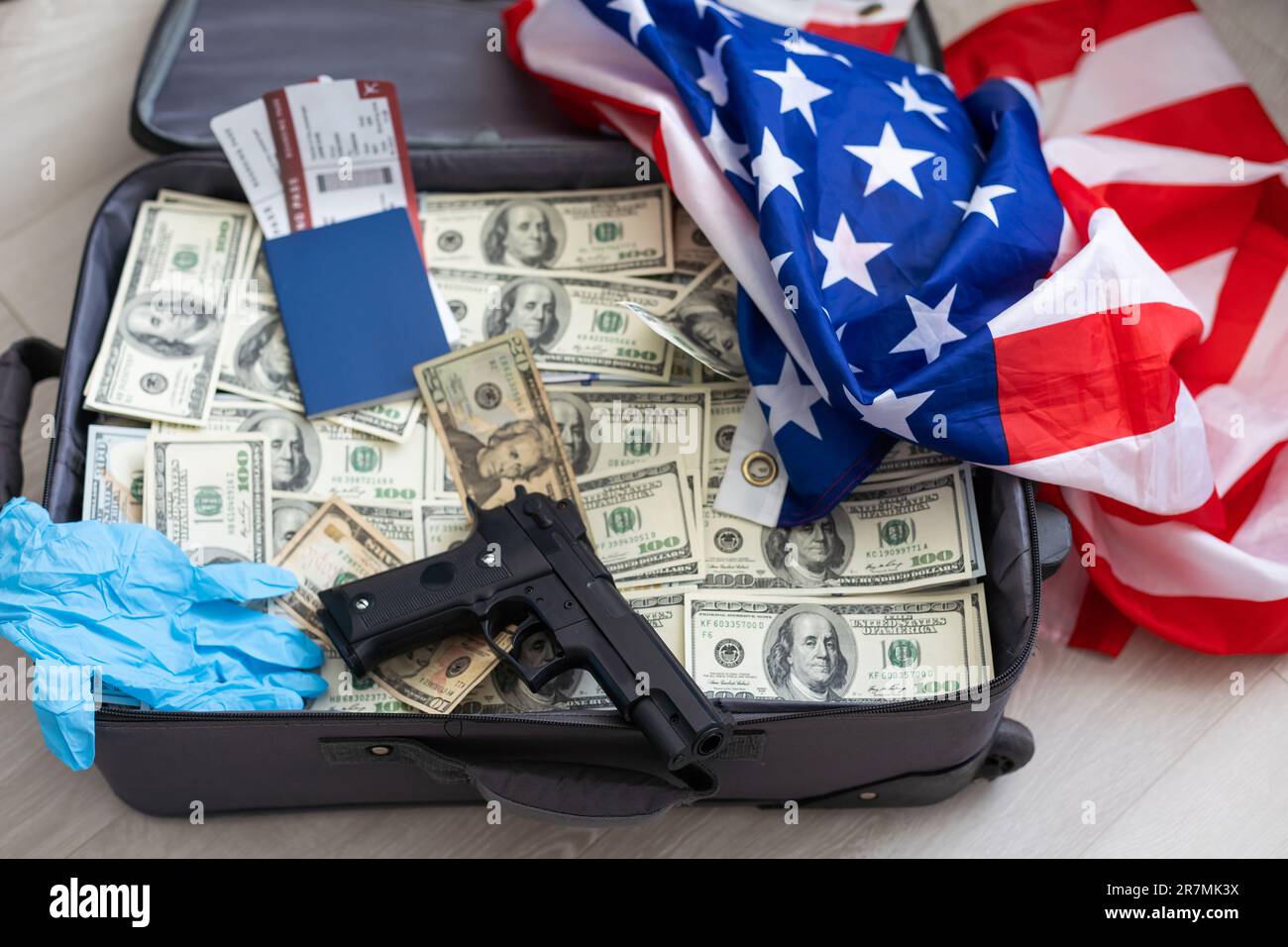 Suitcase with pile of dollars. Opened silver case with money. Better to ...