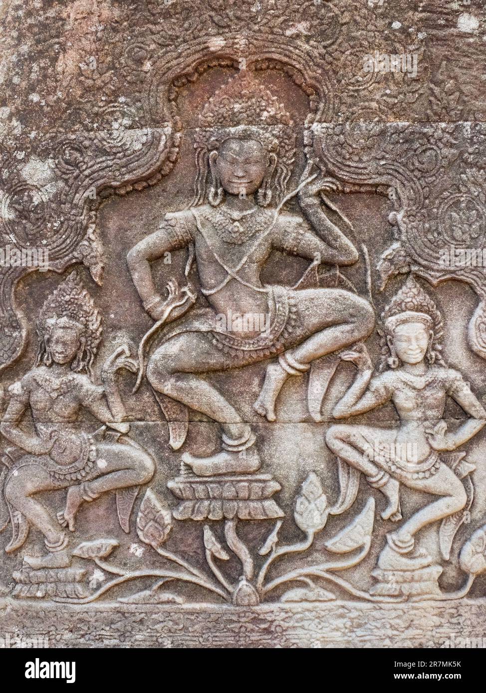 Ancient bas-reliefs on the walls of the Khmer Bayon Temple depict ...