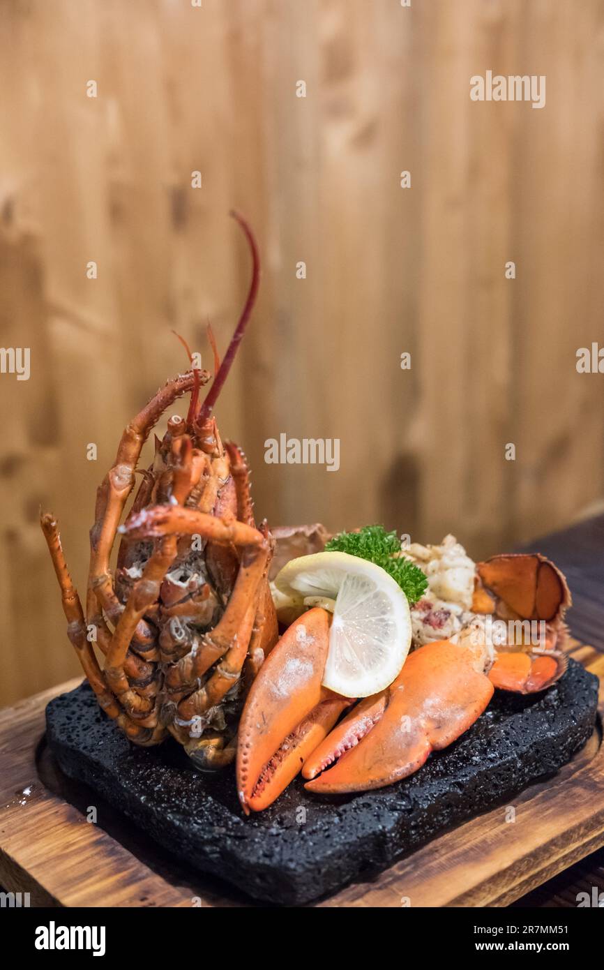 Grilled Lobster with lemon served on plate Stock Photo - Alamy