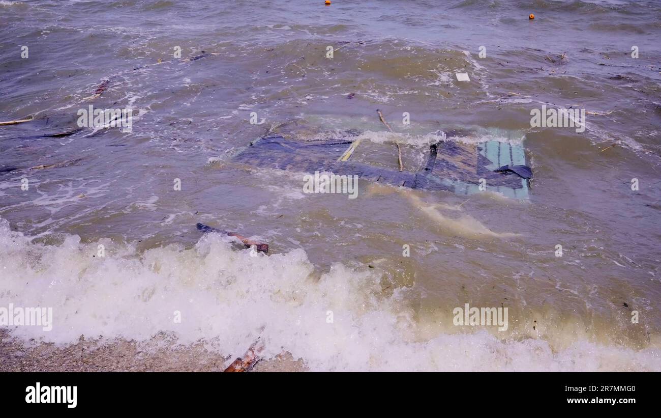 Part of wall of house floats near shore, floating debris has reached ...