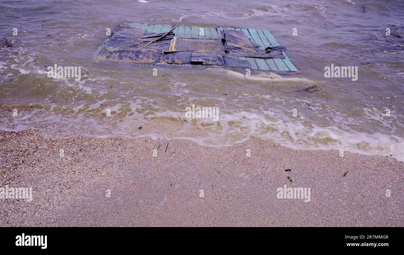 Part of wall of house floats near shore, floating debris has reached ...