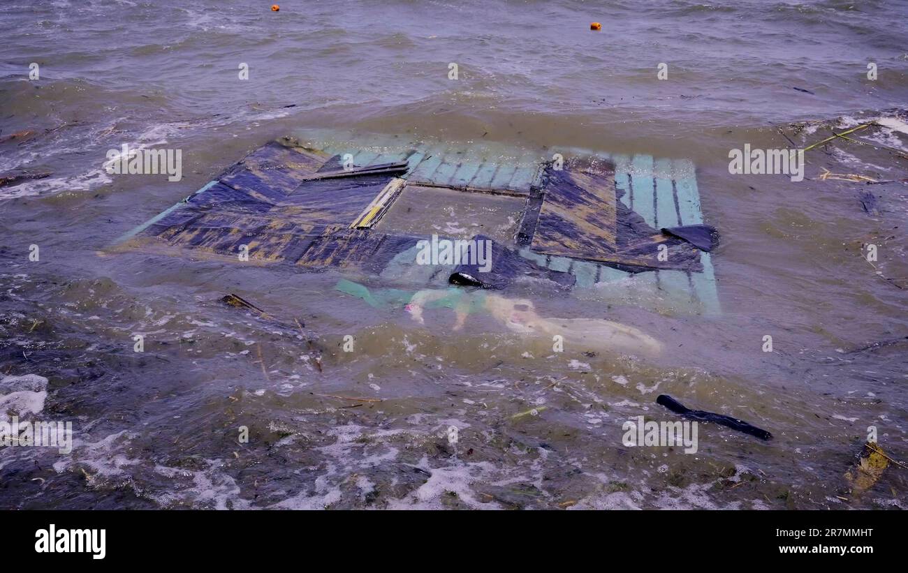 Part of wall of house floats near shore, floating debris has reached ...