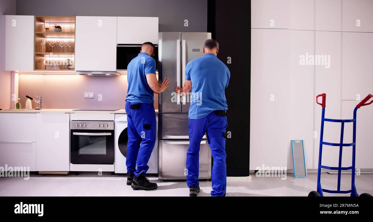 Delivery And Install Of Refrigerator Appliance. Mover Carrying Fridge ...