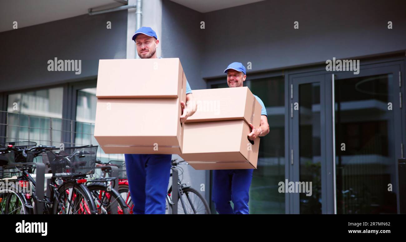 Truck Mover Unloading Van Carrying Boxes And Moving House Stock Photo ...