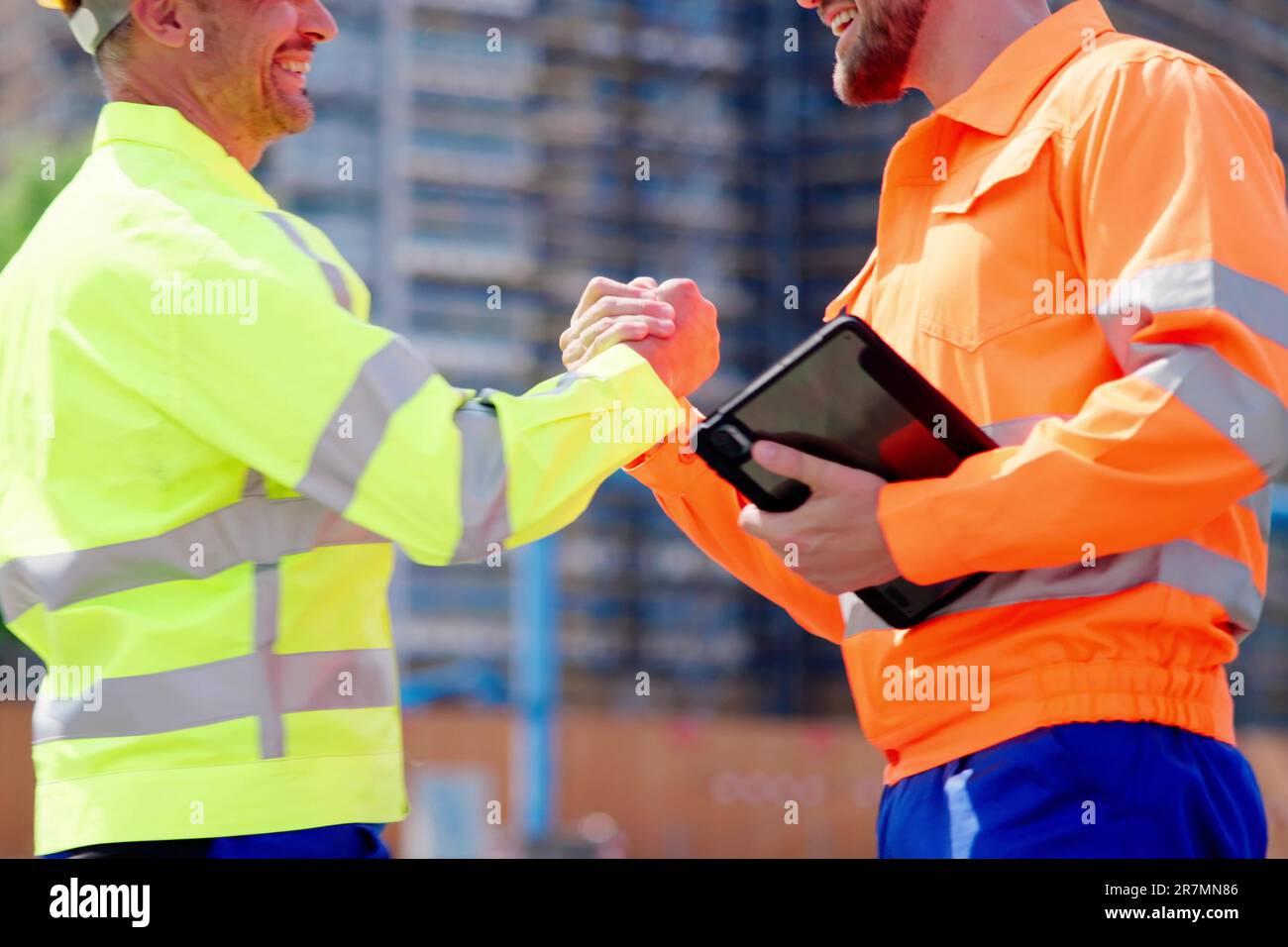 Construction Site Worker Hand Shake. Engineer Handshake Stock Photo - Alamy