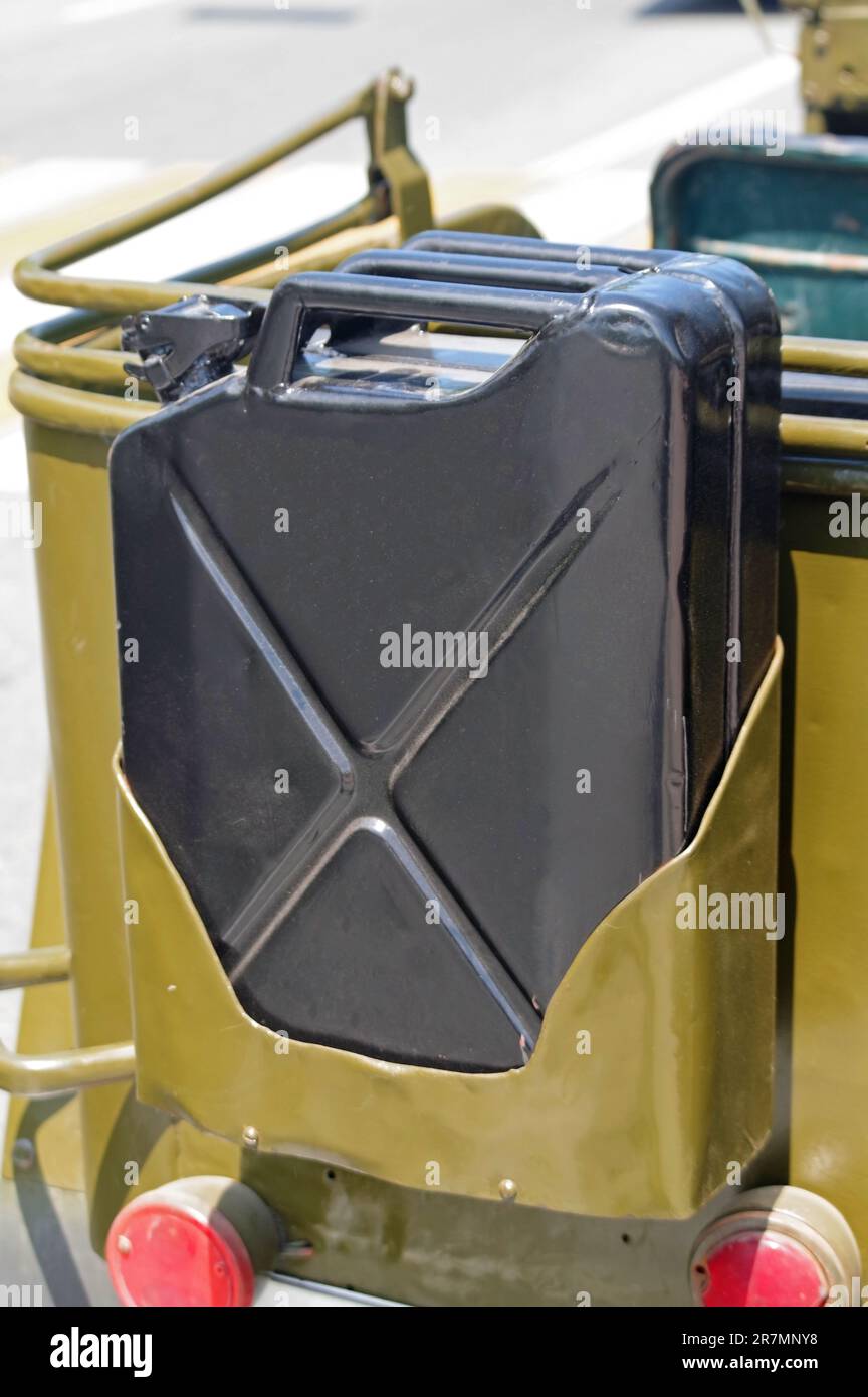 Close up of old fuel tank hanging on the backside of the military car ...