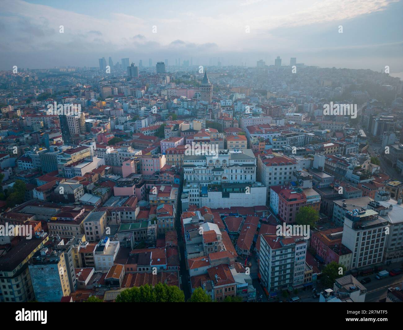 Galata Tower aerial view with morning twilight in Beyoglu district in ...