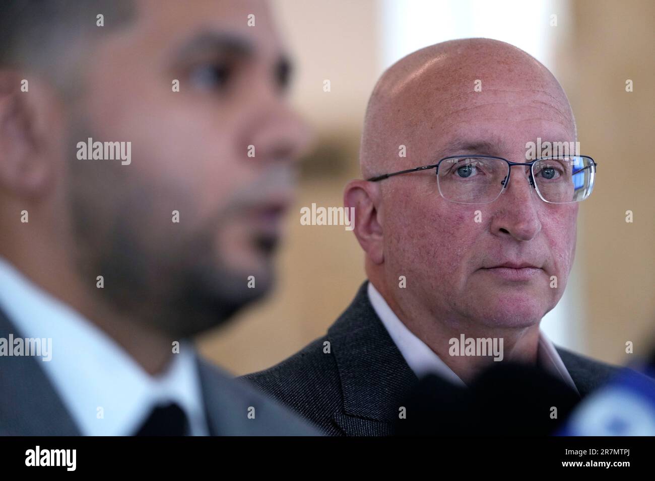 Attorney George Gomez, left, talks to media as Robert E. Crimo Jr ...