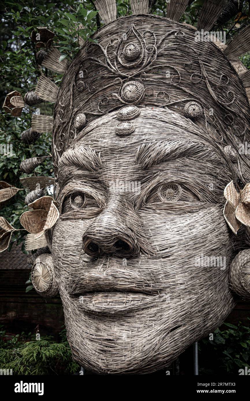 Wicker balinese face at a resort shot close up Stock Photo - Alamy