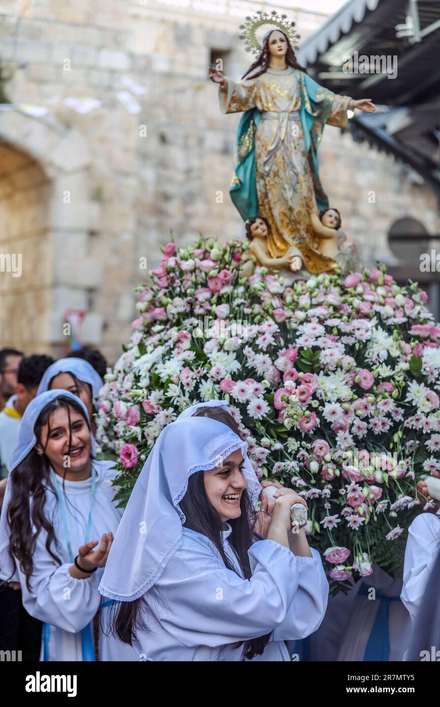 Young Catholic maidens, dressed in white, carrying an icon of the ...