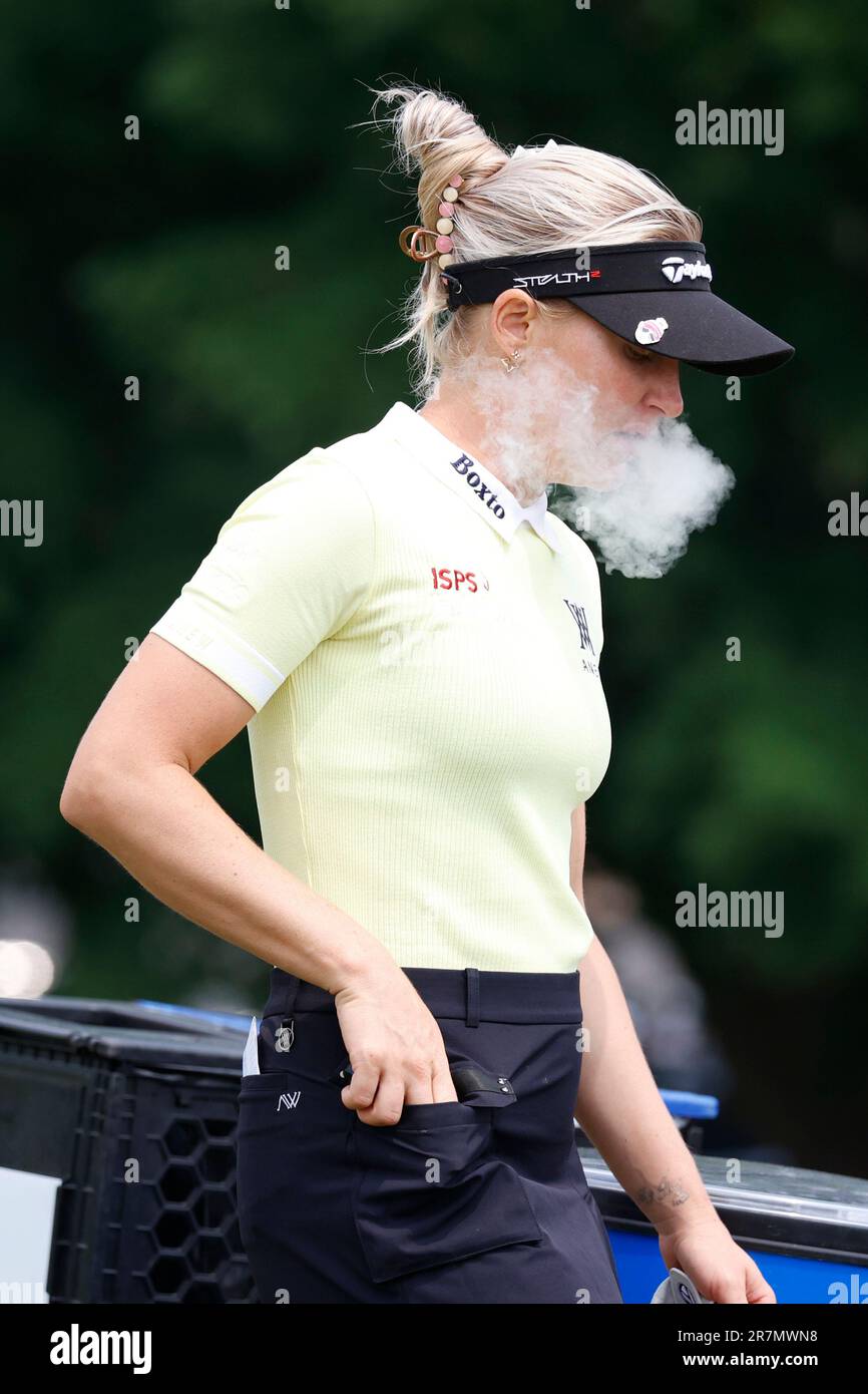 GRAND RAPIDS, MI - JUNE 16: LPGA golfer Charley Hull blows smoke from ...