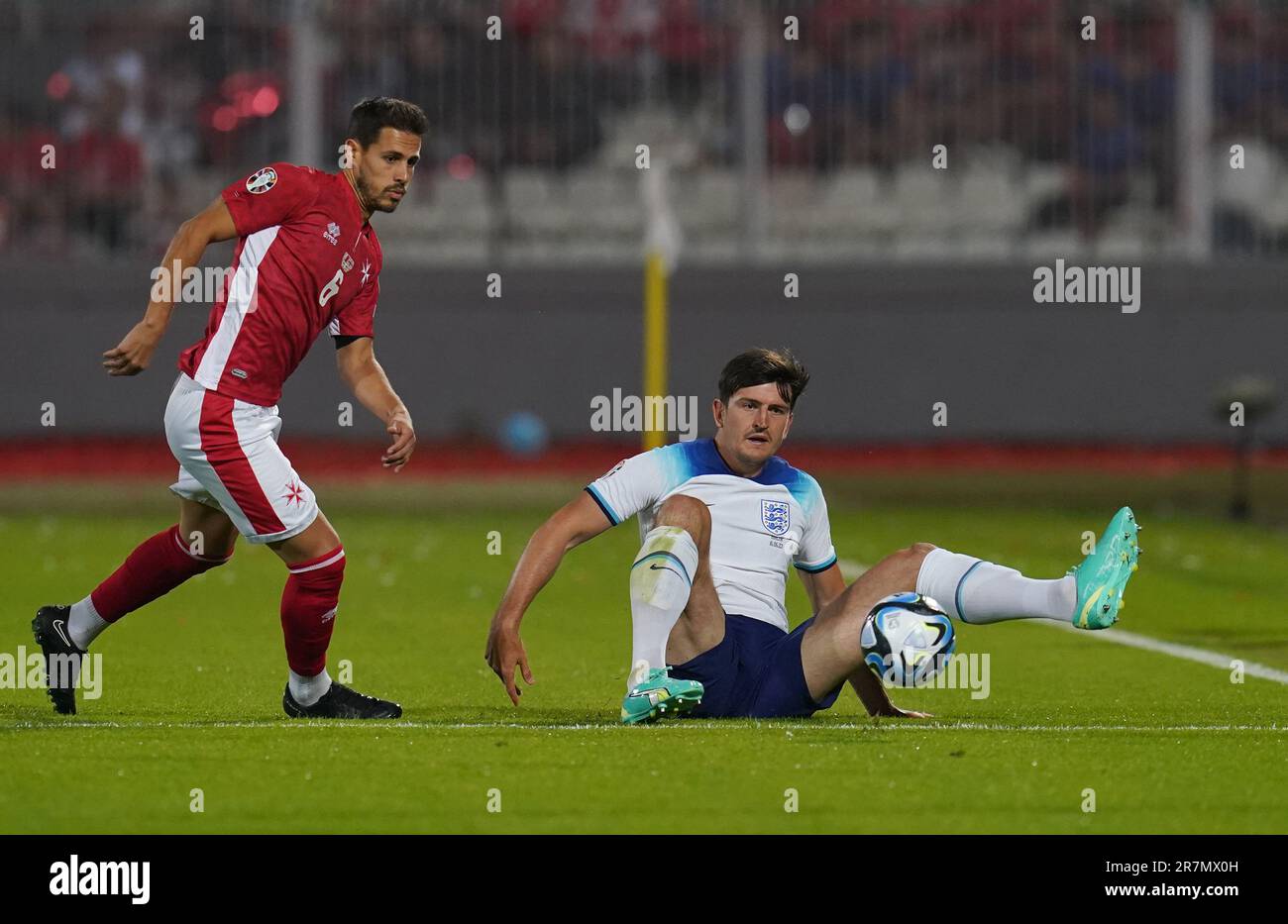 Malta's Matthew Guillaumier (left) and England's Harry Maguire in ...