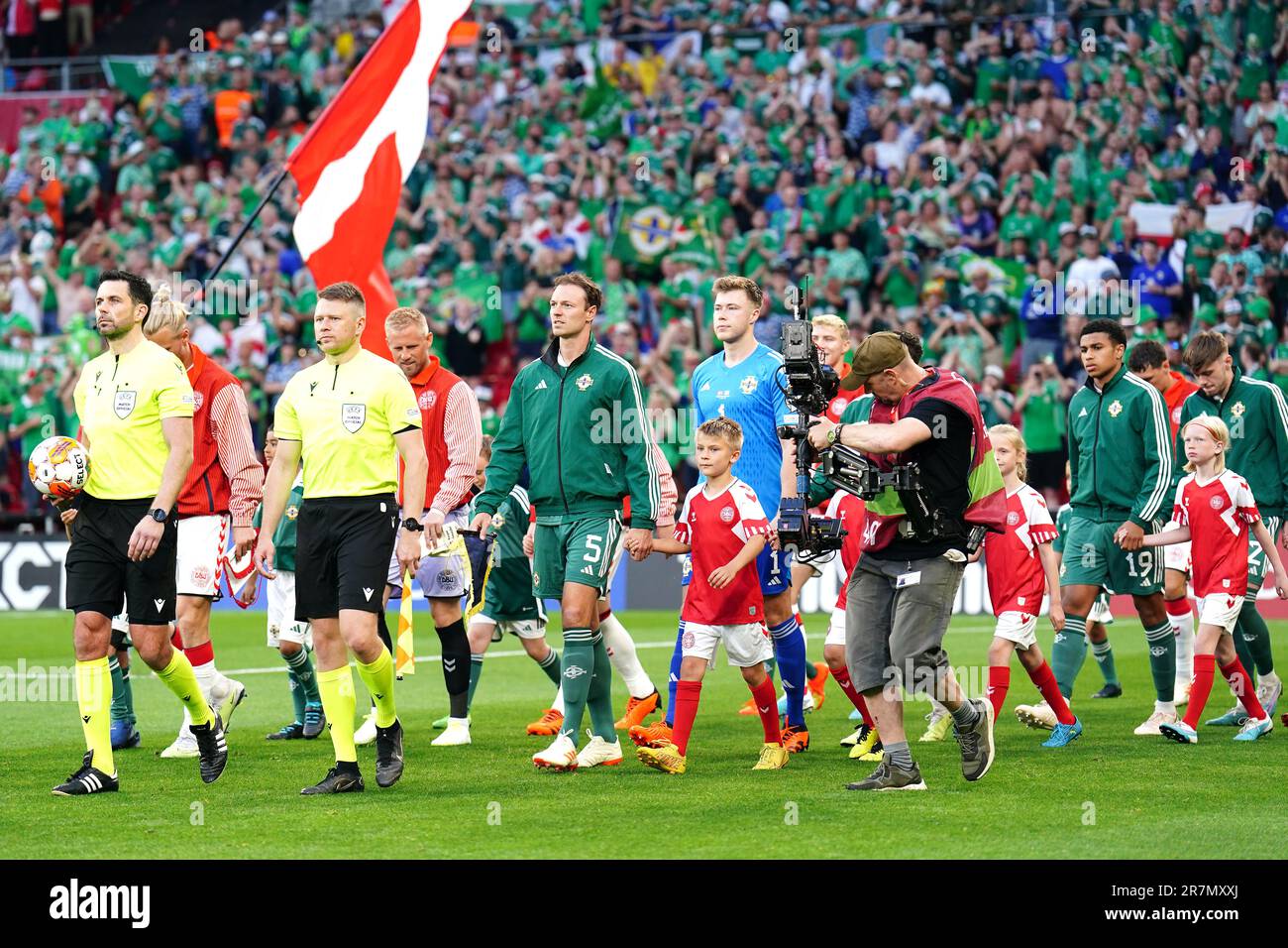 Denmark and Northern Ireland players walk out onto the pitch before the ...