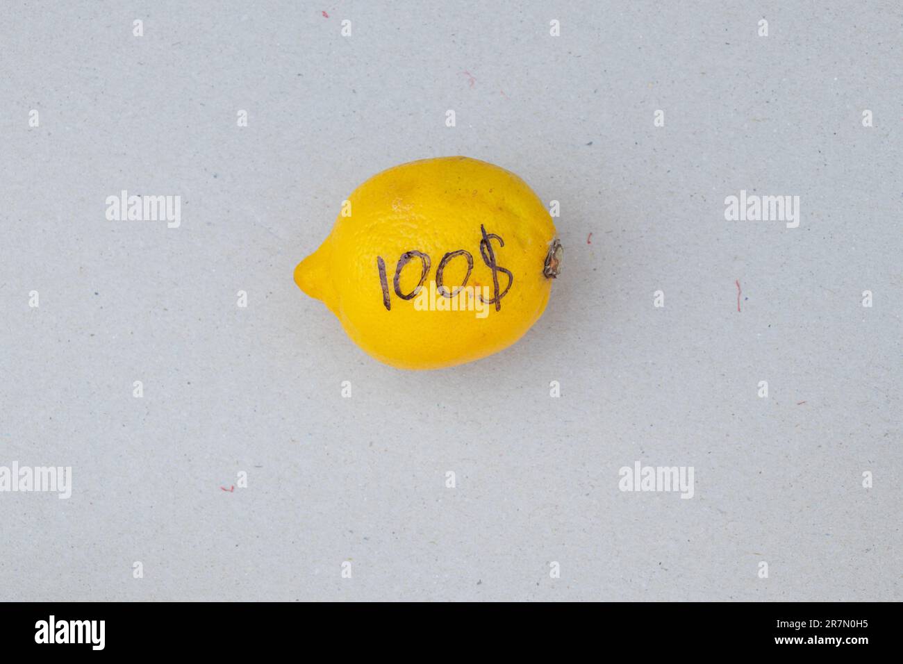 100 dollars written with on lemon on an isolated background Stock Photo ...