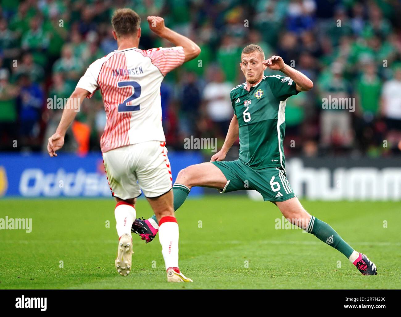 Northern Ireland's George Saville (right) and Denmark's Joachim ...