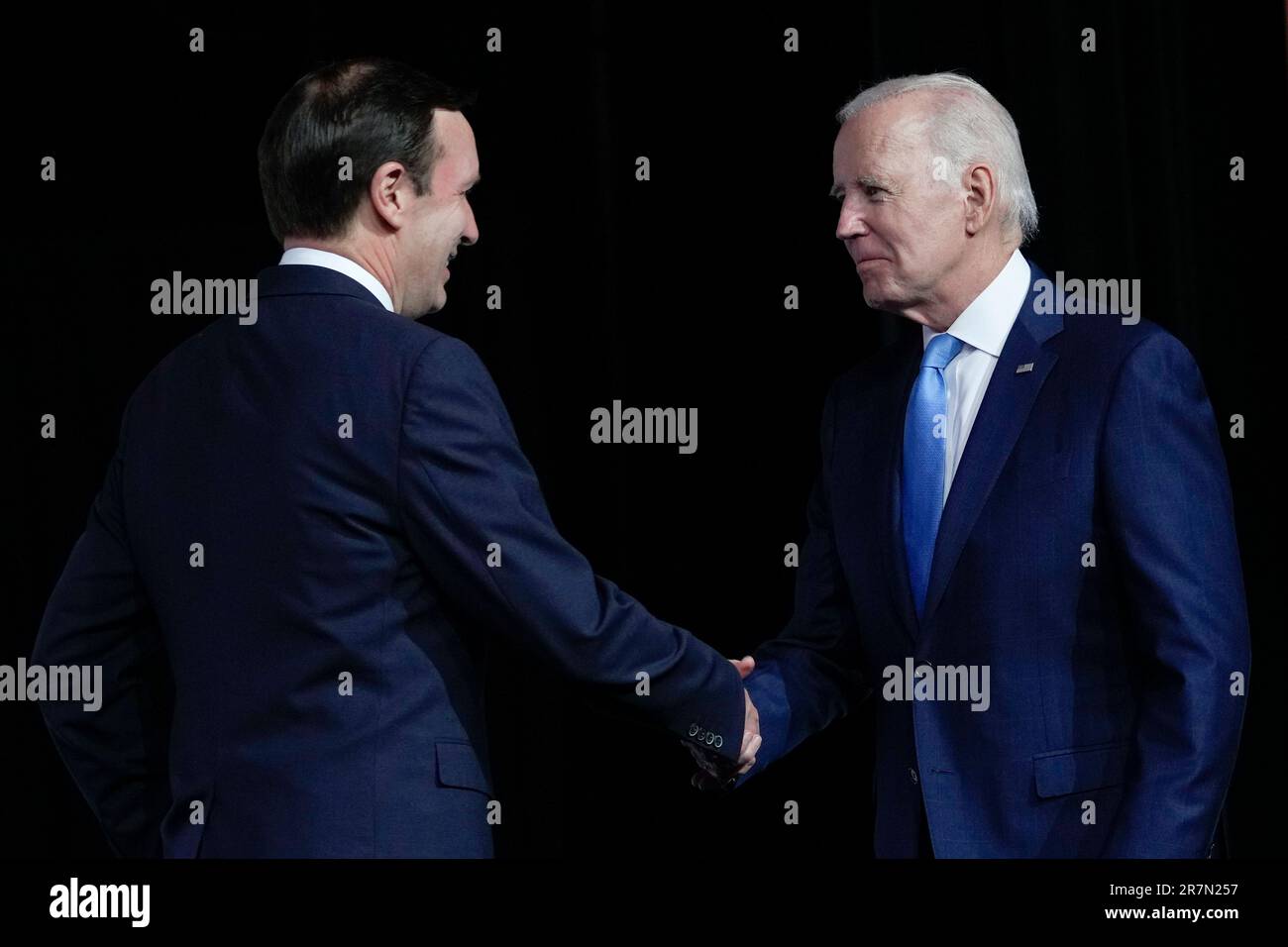 President Joe Biden shakes hands with Sen. Chris Murphy, D-Conn., after ...