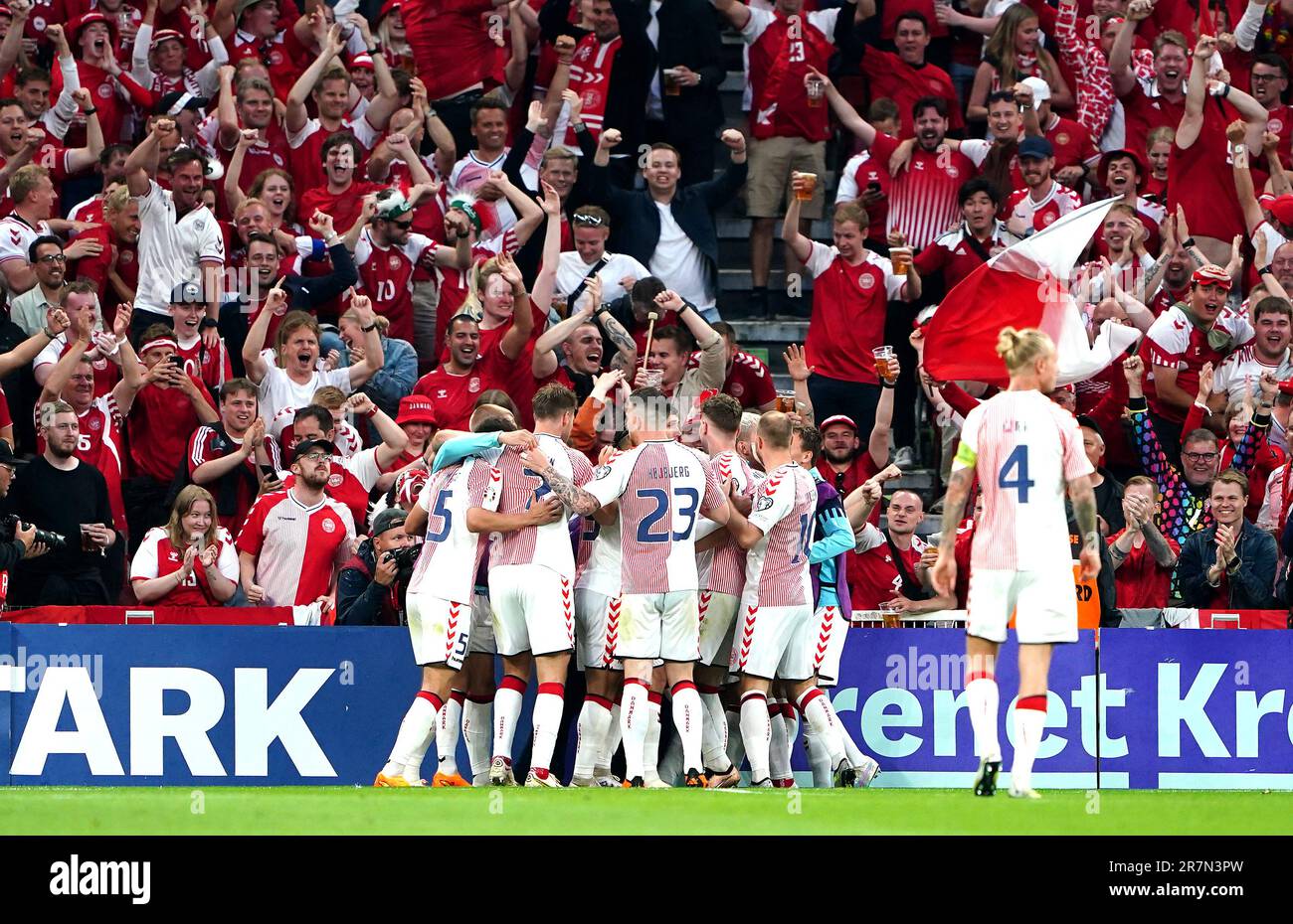 Denmark's Jonas Wind (hidden) celebrates scoring their side's first ...