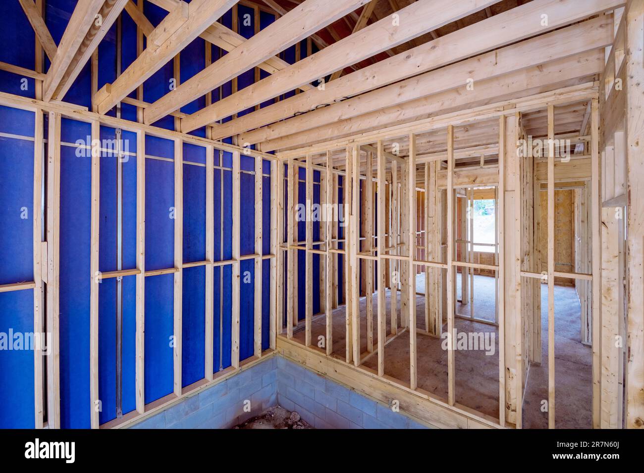 Residential incomplete wooden home framing beams inside view in new ...