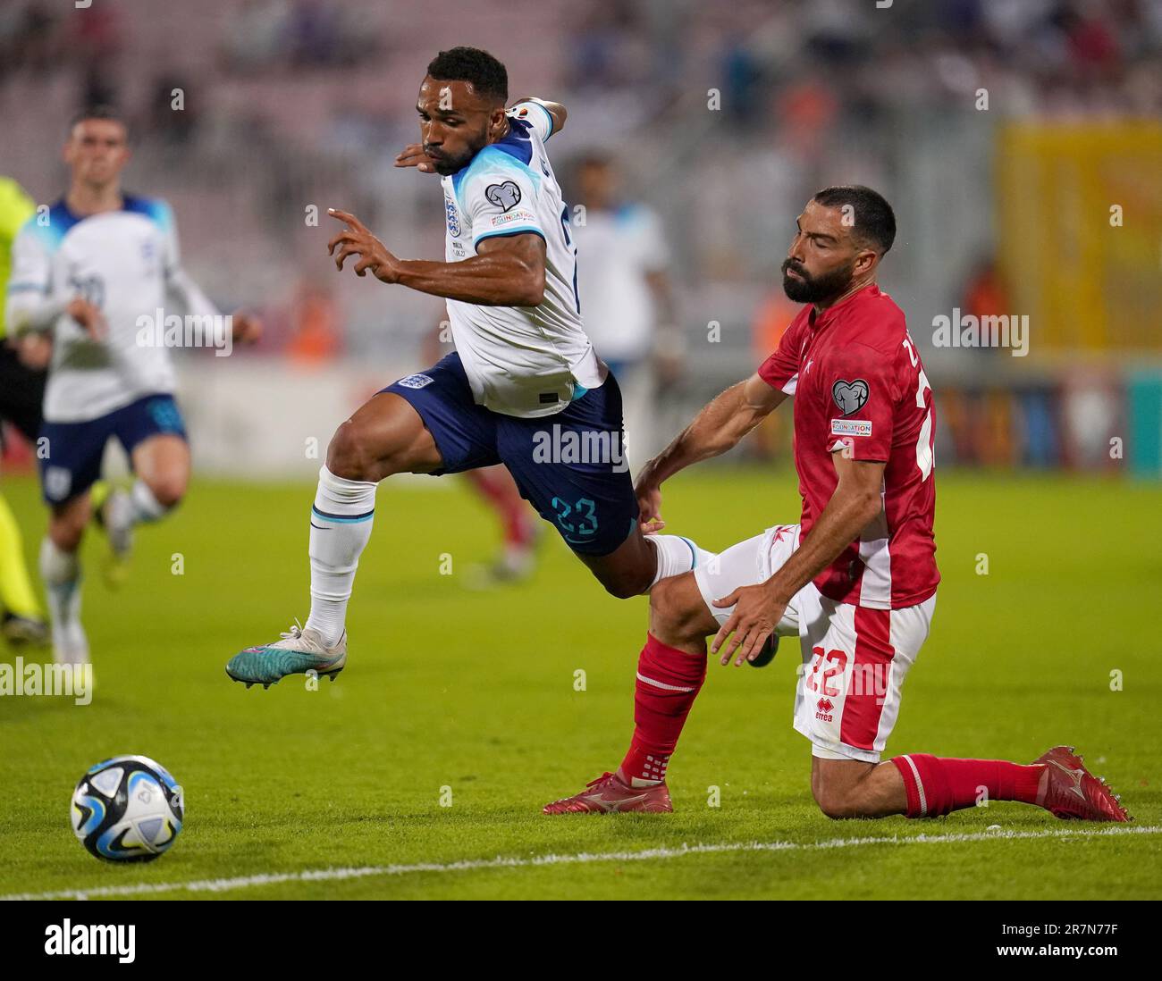 England's Callum Wilson (left) and Malta's Zach Muscat battle for the ...