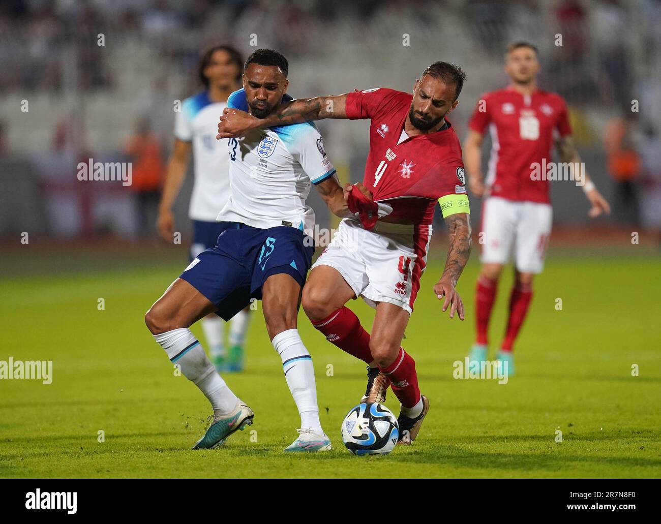 England's Callum Wilson (left) and Malta's Steve Borg battle for the ...