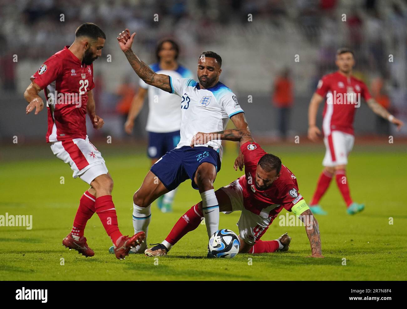 England's Callum Wilson (centre) battles with Malta's Steve Borg (right ...