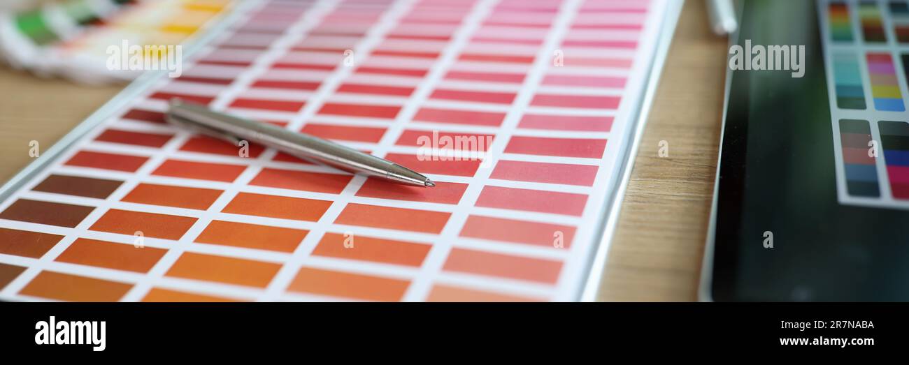 Color palette with different shades and tablet on table Stock Photo - Alamy
