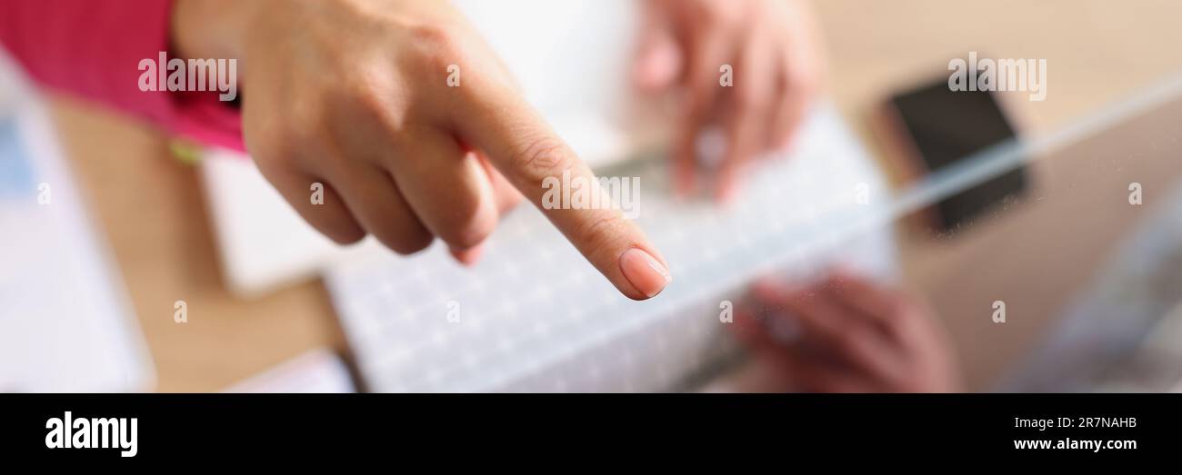 Female hands pointing finger at screen on monitor Stock Photo - Alamy