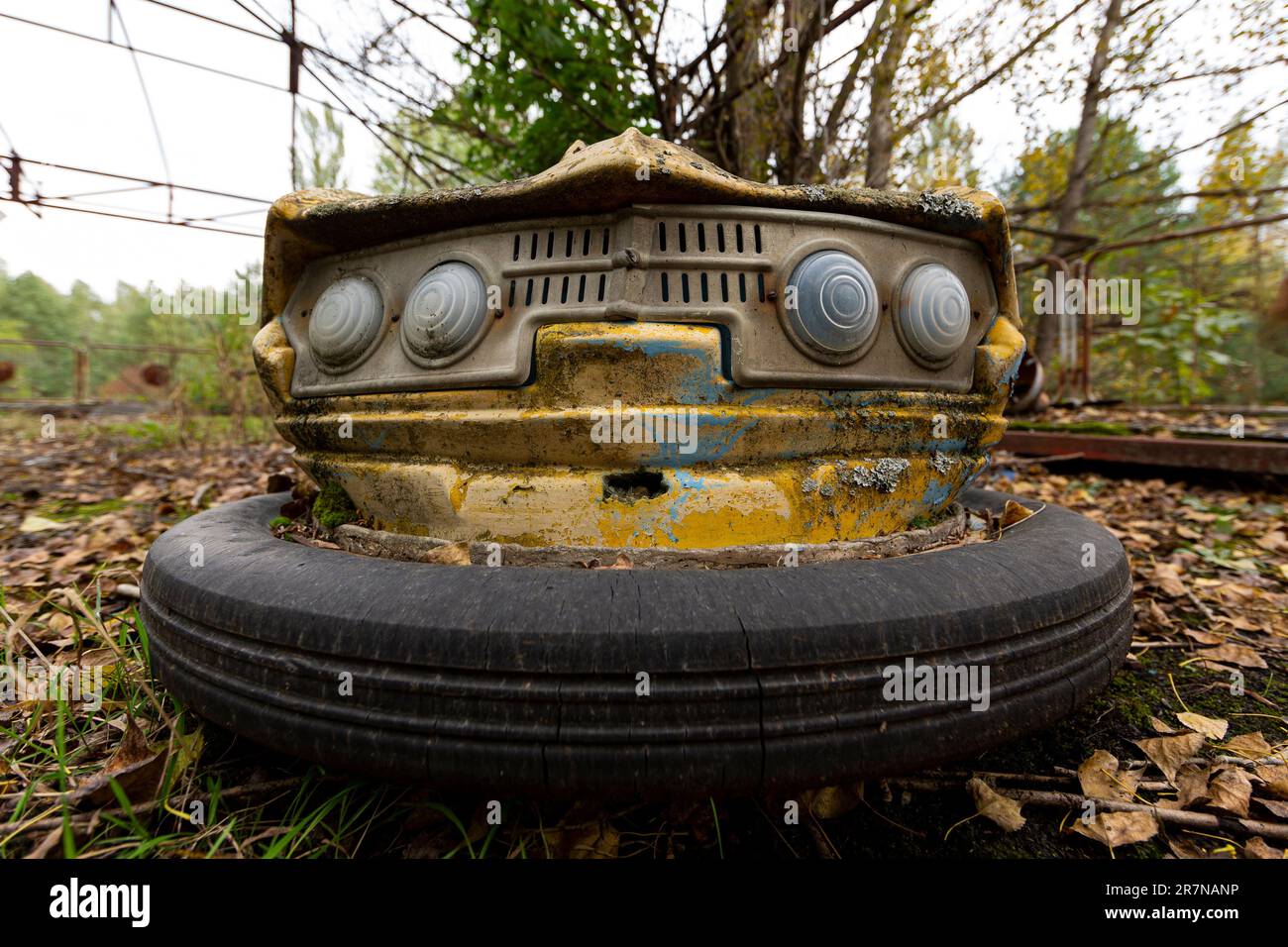 A closeup of an old yellow bumper car in the Pripyat amusement park ...