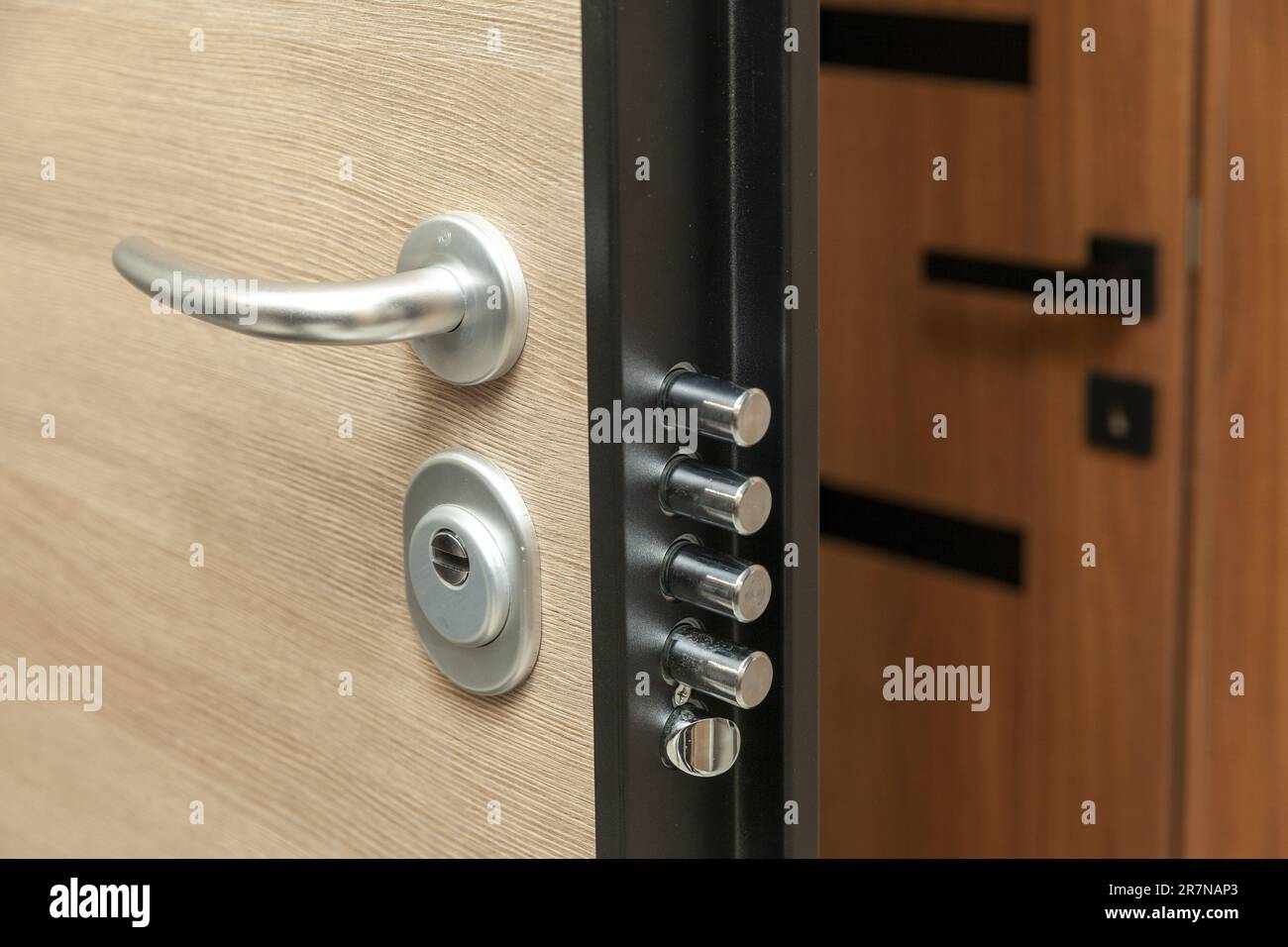 Safety lock on the safety door, metal handle, close up Stock Photo - Alamy