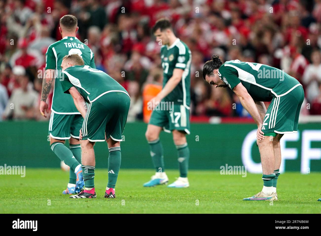 Northern Ireland players look dejected following defeat in the UEFA ...