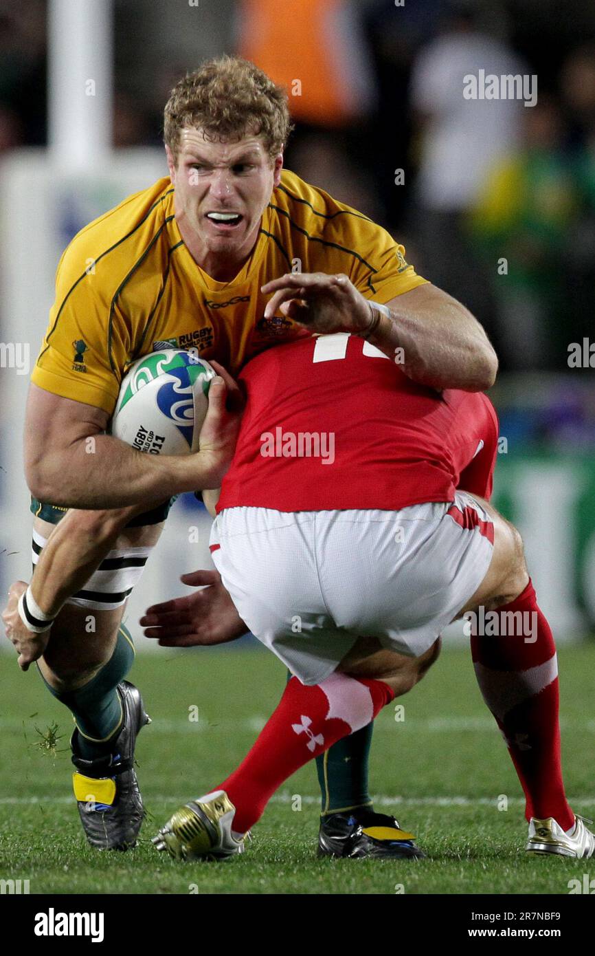 Australia’s David Pocock is tackled by Wales James Hook during the ...