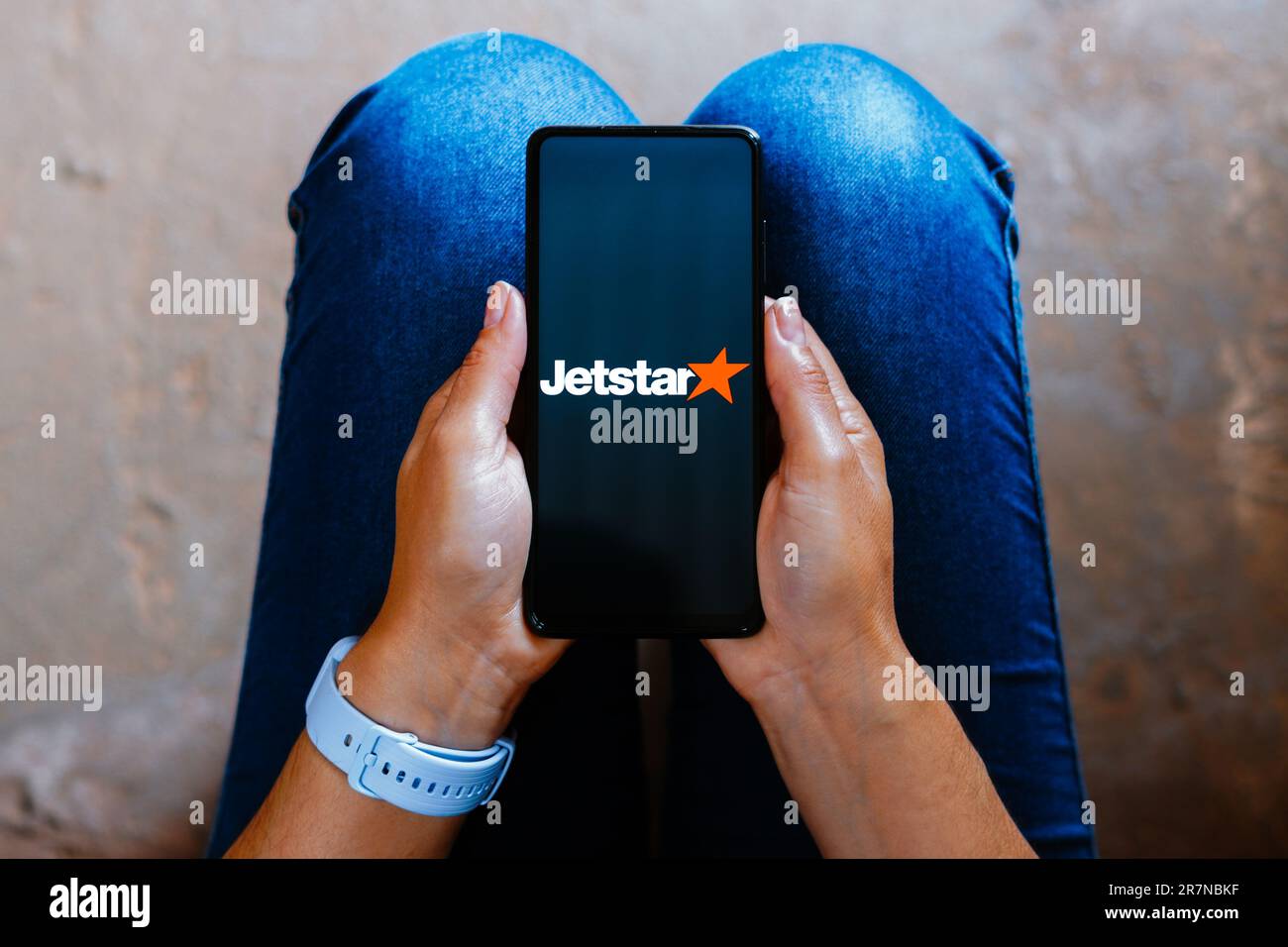 In this photo illustration, the Jetstar Airways logo is displayed on a ...