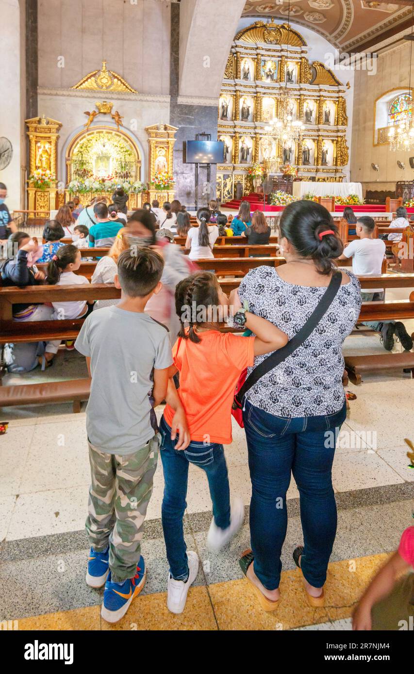 Filipino Praying In Church