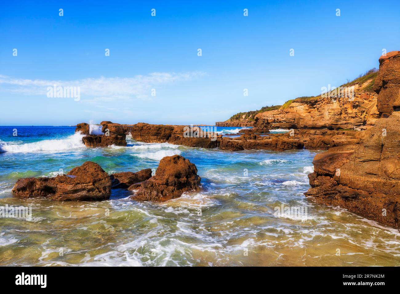 Sandstone cliffs on Caves beach of Pacific coast in Australia - scenic ...