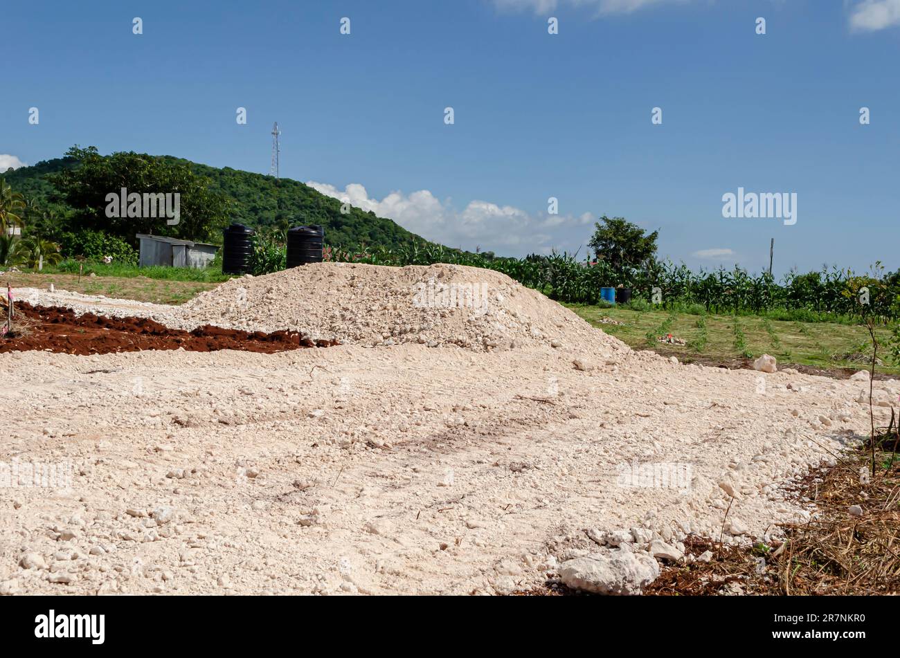 During the construction of a roadway marl is dumped on the path in ...