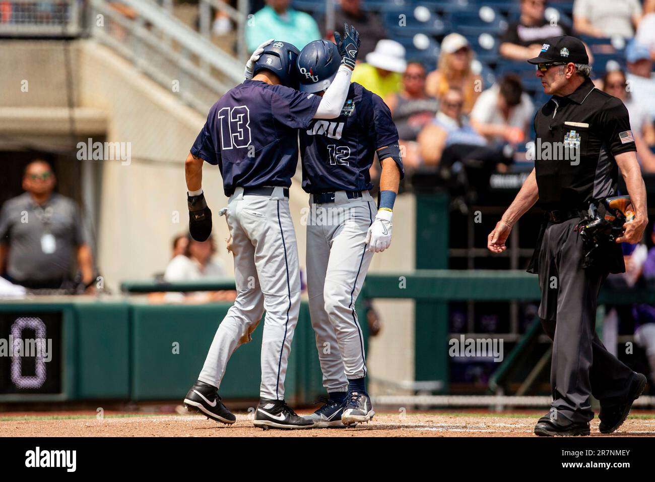 Oral Roberts' Mac McCroskey (12) celebrates his two-run home run ...