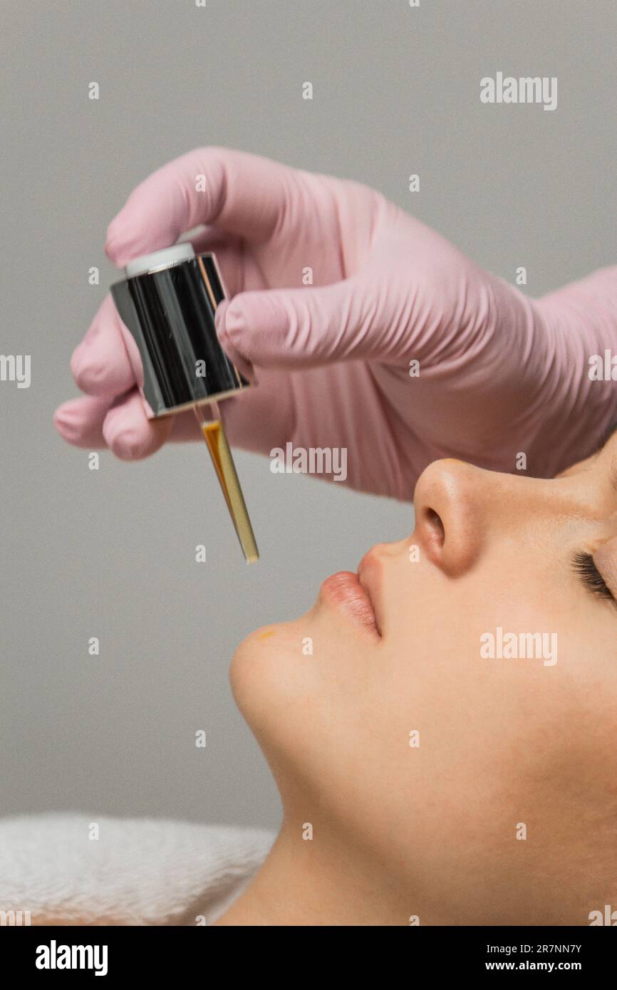 preparation for procedures in the cosmetologist s office. applying oil ...