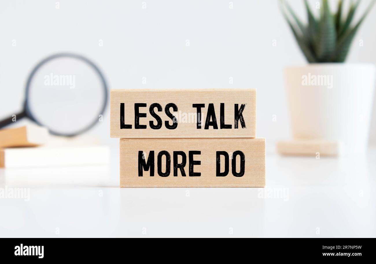 Less Talk more Do, written on a sticky note Stock Photo - Alamy