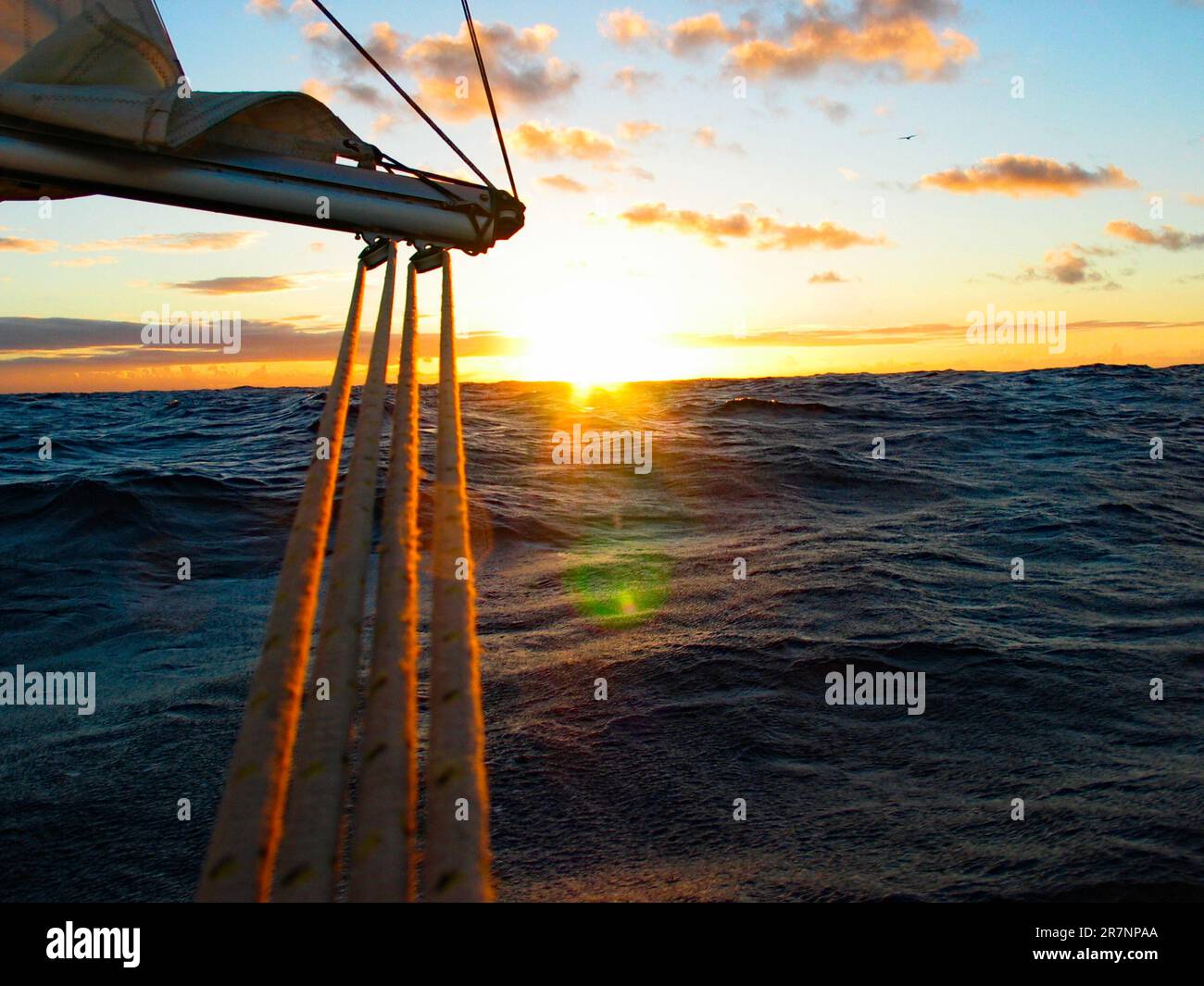 View from the deck of a sailboat crossing an ocean, visible part of the ...