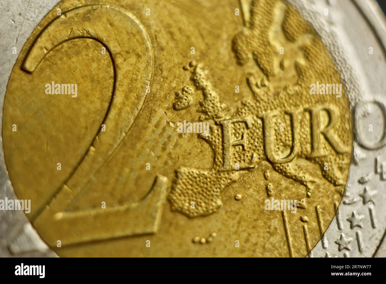 two euro coin close up isolated on black background. Detail of metallic ...