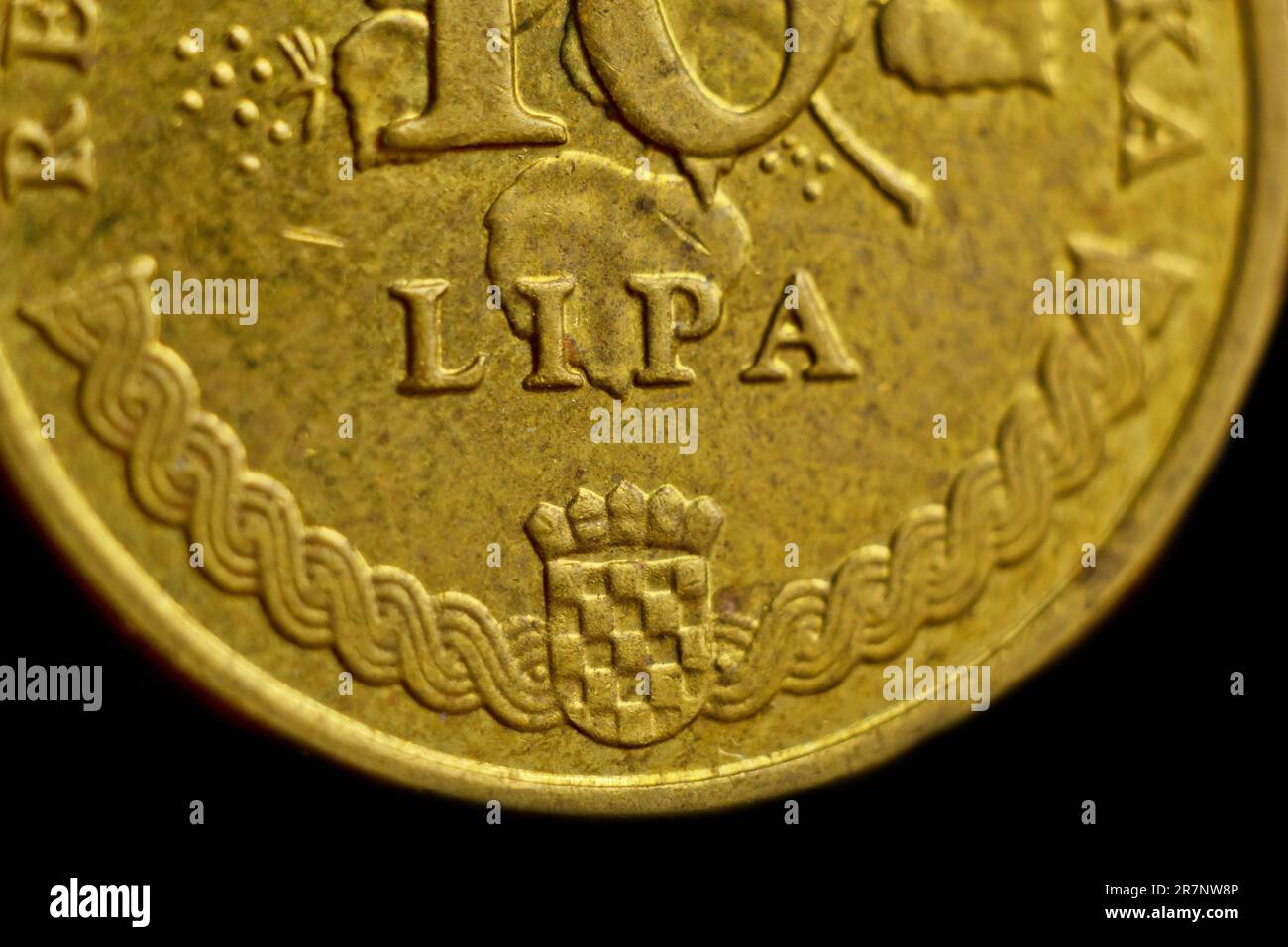 Coin ten Croatian lipa macro isolated on black background. Detail of ...