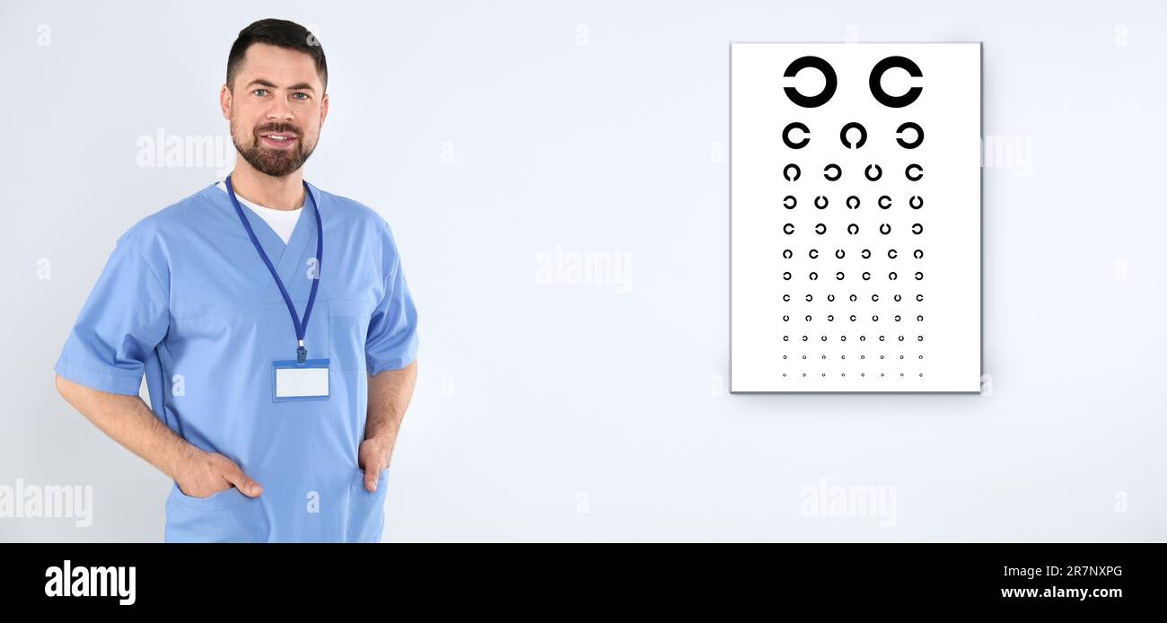 Vision test. Ophthalmologist or optometrist and eye chart on white ...